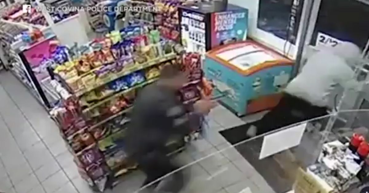 Clerk in Middle of Armed Robbery Is Busy Loading Cash Bag When the ...